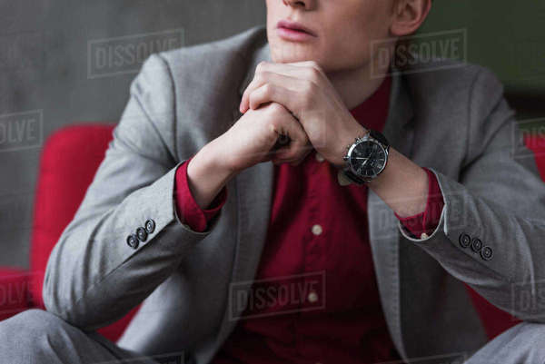 Cropped view of male fashion model with wristwatch - Stock Photo - Dissolve