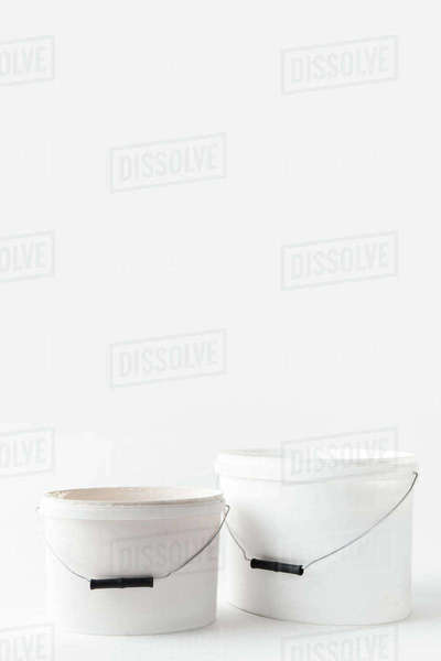 Two plastic white buckets with paints isolated on white - Stock Photo ...