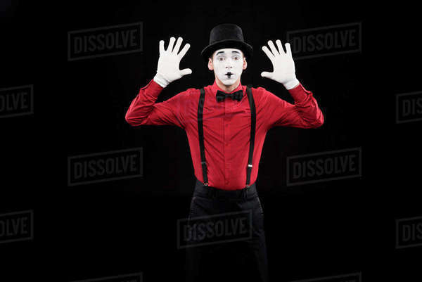 Mime with hands up isolated on black - Royalty-free Stock Photo | Dissolve