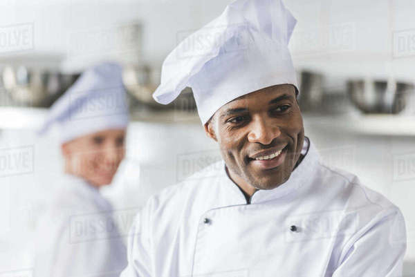 Smiling multicultural chefs at restaurant kitchen - Royalty-free Stock ...
