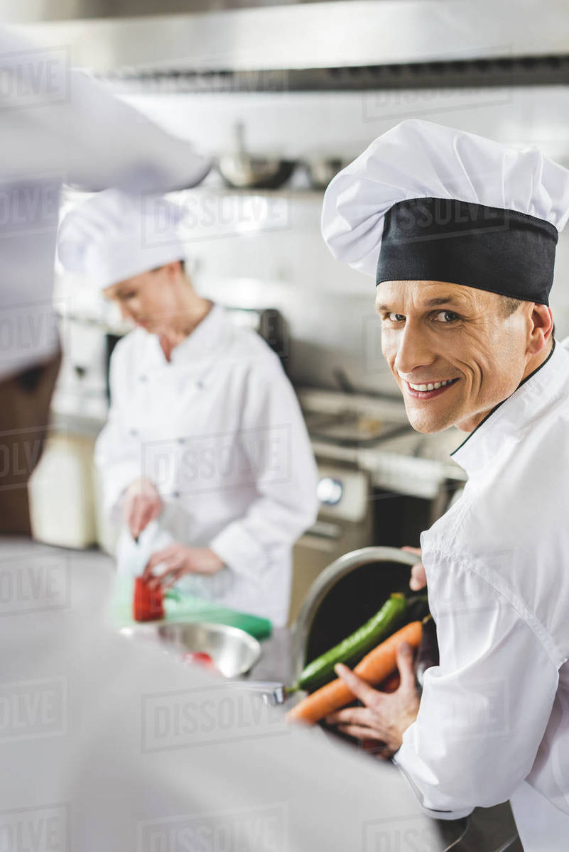 Multicultural chefs cooking at restaurant kitchen - Stock Photo - Dissolve