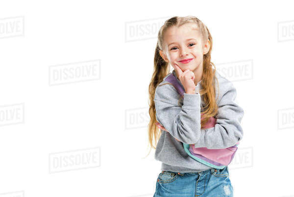 Smiling little child holding finger on chin isolated on white - Stock ...