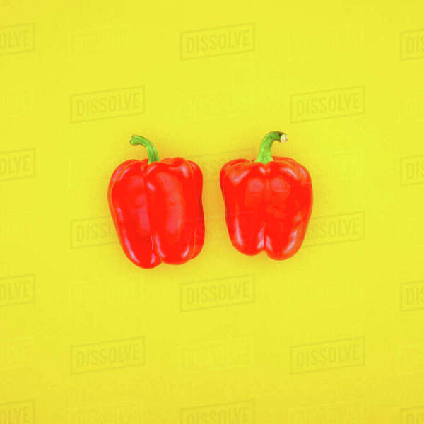 Top view of fresh red paprika peppers isolated on yellow - Royalty-free ...