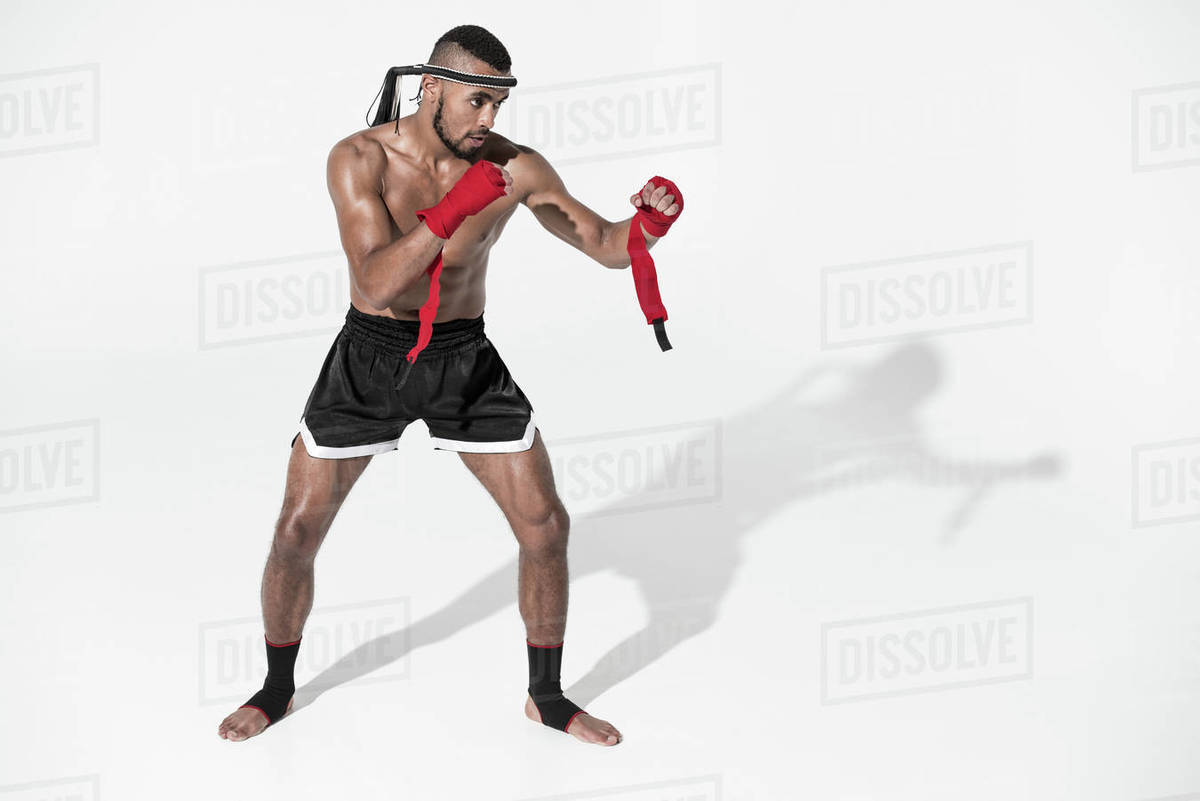 side view of muay thai fighter training isolated on white, fight club ...