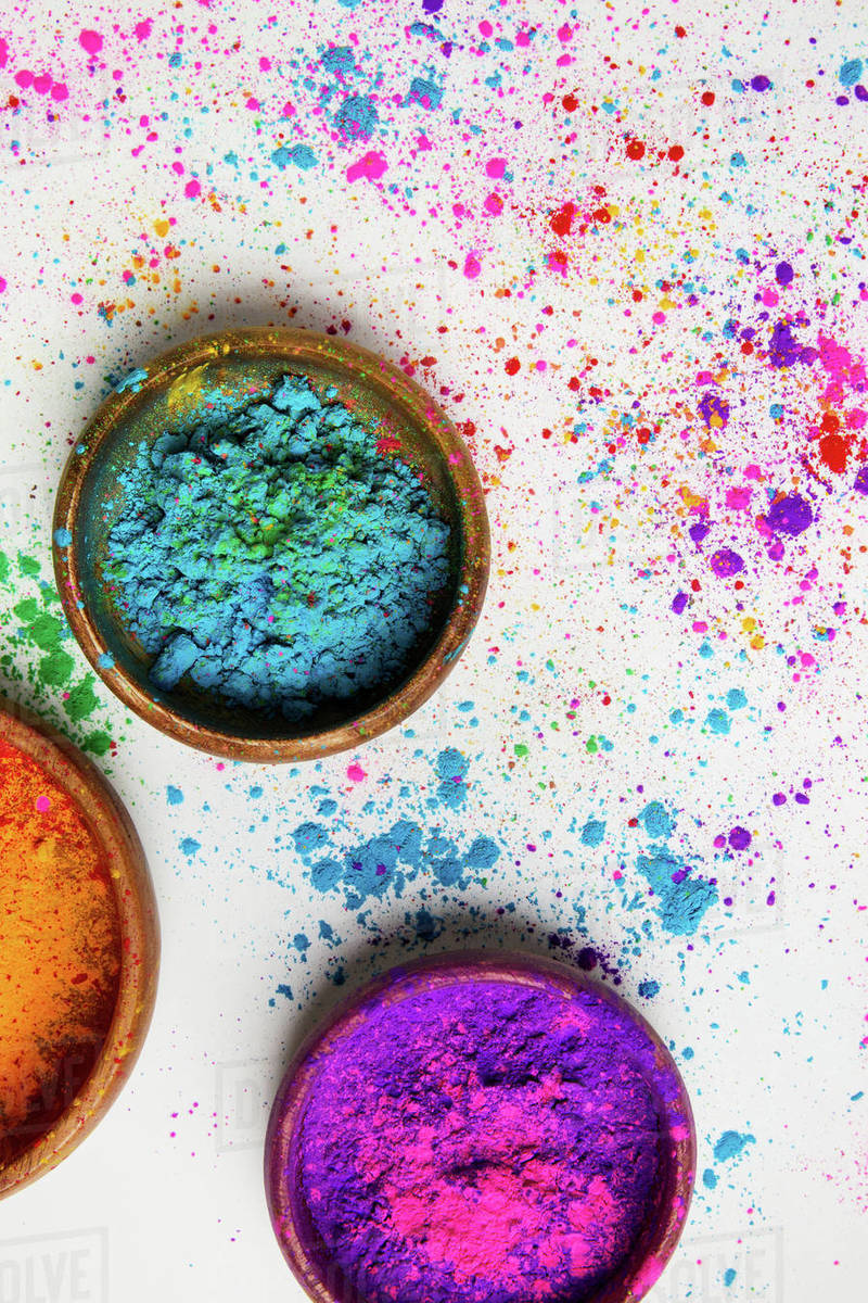 Top view of colorful holi powder in bowls isolated on white - Stock ...