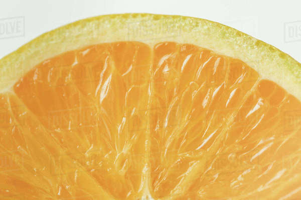 Close-up view of ripe orange fruit flesh isolated on white background ...