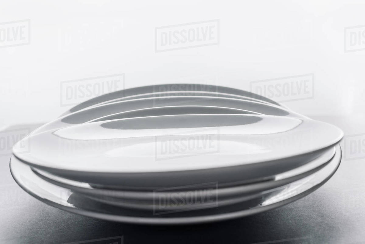 Shiny white kitchen ceramic plates - Royalty-free Stock Photo | Dissolve