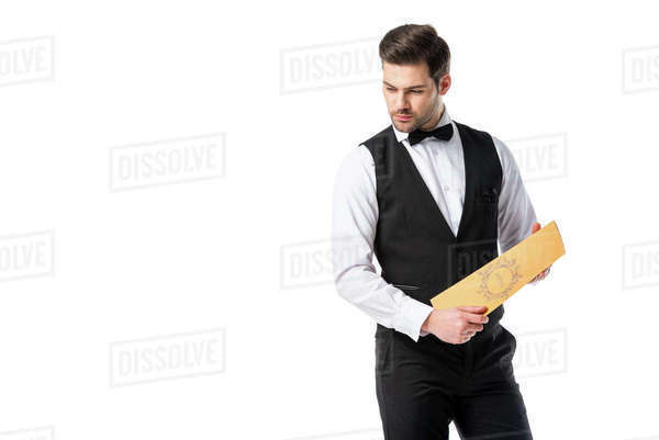 Portrait of young waiter in suit vest with menu isolated on white ...