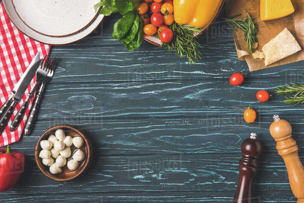 Top view of vegetables on wooden table in kitchen - Stock Photo - Dissolve