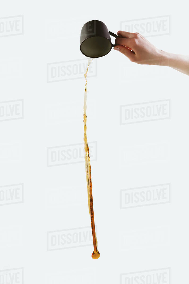 Cropped view of hand pouring out coffee, isolated on white - Royalty ...