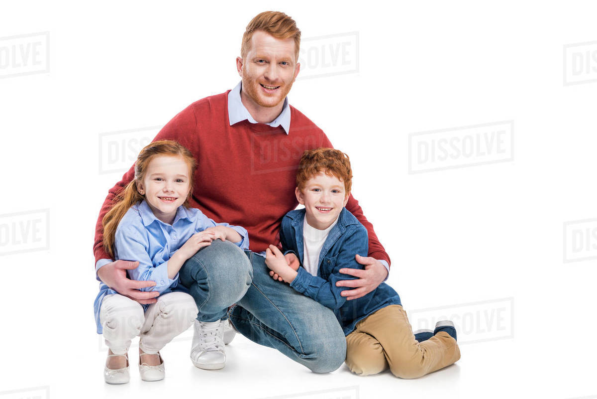 Happy father with cute little kids smiling at camera isolated on white ...