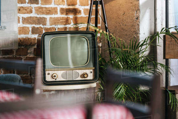Vintage tv with blank screen in 50s style interior - Stock Photo - Dissolve