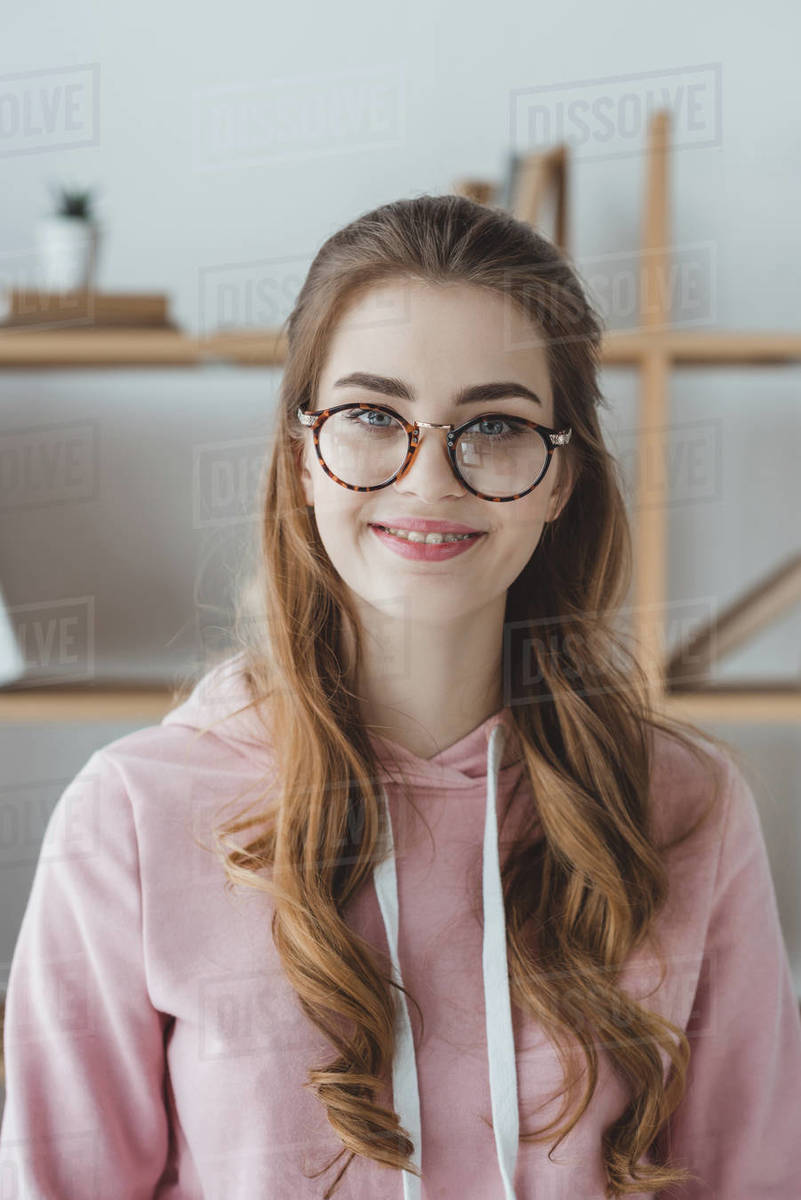 Portrait of cheerful female student in trendy eyeglasses - Royalty-free ...