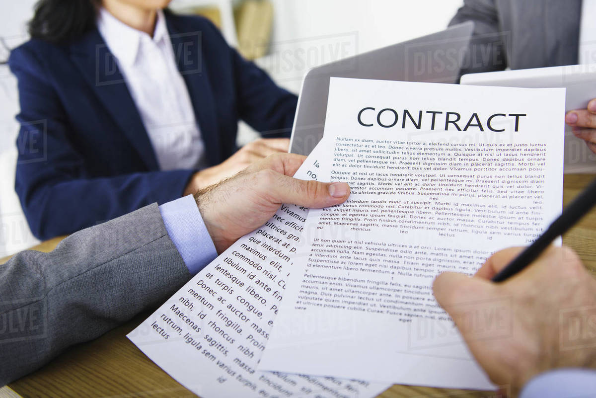 Cropped image of businessman signing contract in office - Royalty-free ...