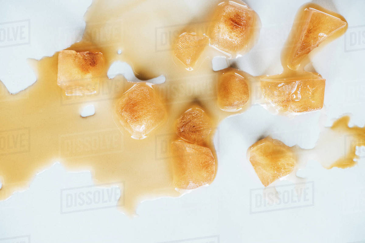 Top view of brown ice cubes made of coffee on white tabletop - Royalty ...