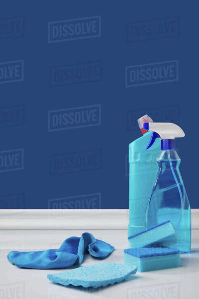 Spray, rags and washing sponges for spring cleaning on blue - Royalty ...