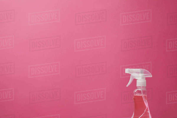 Spray bottle with antiseptic liquid isolated on pink - Royalty-free ...