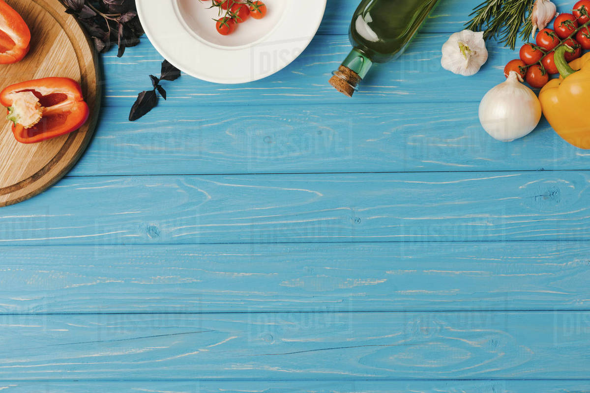 Top view of ingredients for cooking on blue tabletop - Royalty-free ...