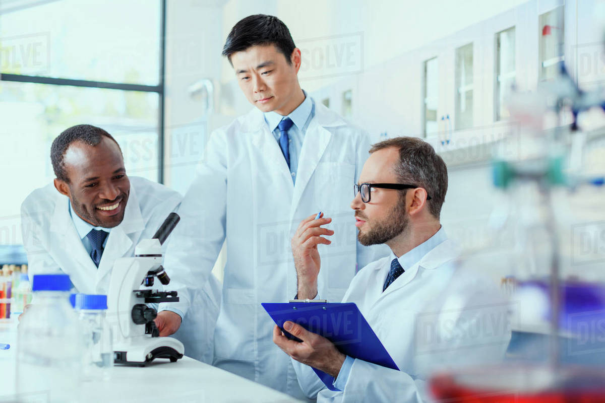 Young doctors in uniform working at testing laboratory, laboratory ...