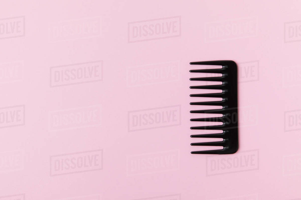 One black comb, isolated on light pink - Royalty-free Stock Photo ...
