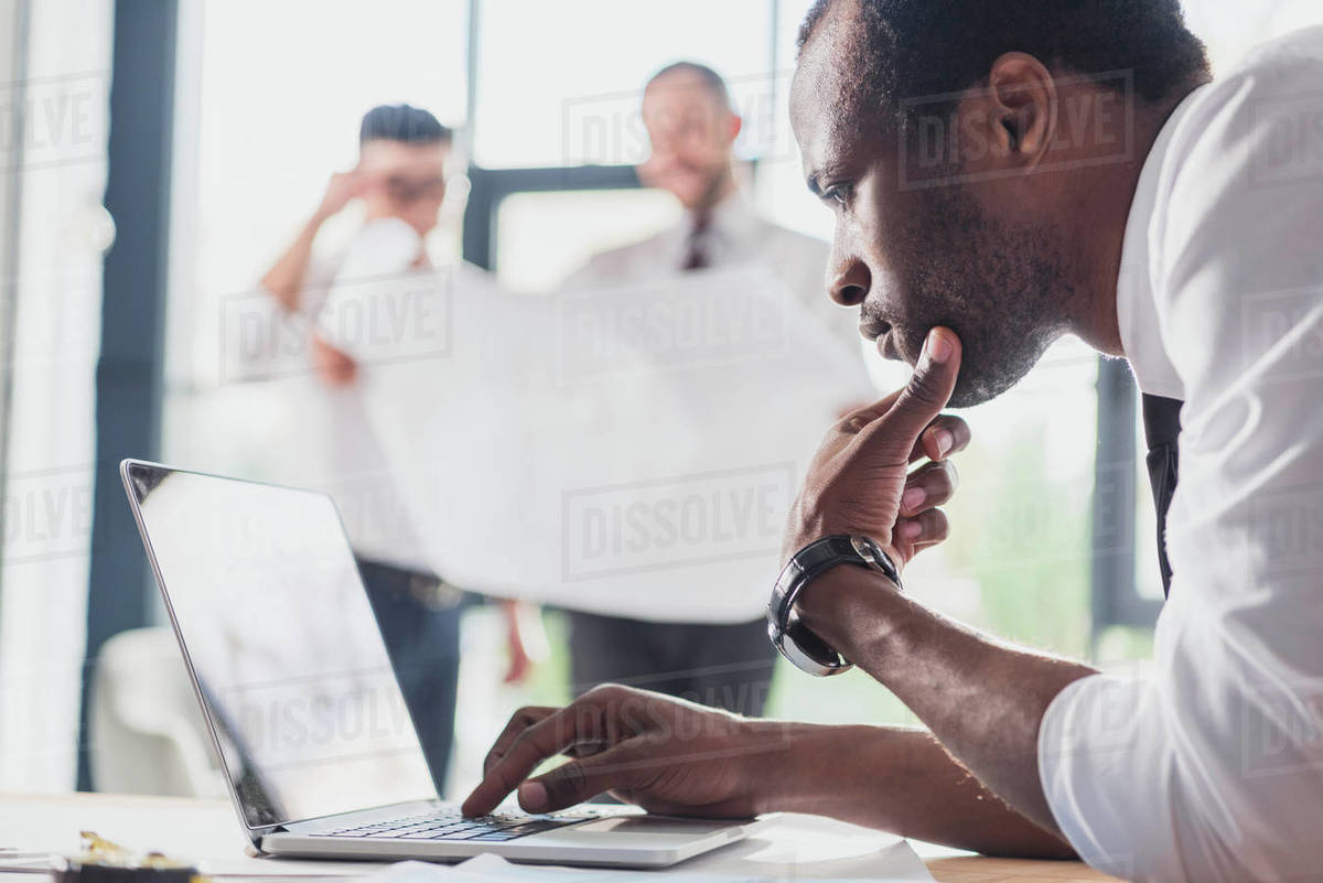 professional architects in formal wear working at modern office ...