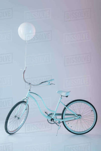 Stylish bicycle with white balloon, isolated on purple - Royalty-free ...