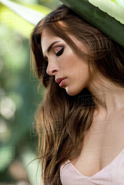 Portrait of attractive young woman looking down - Royalty-free Stock ...