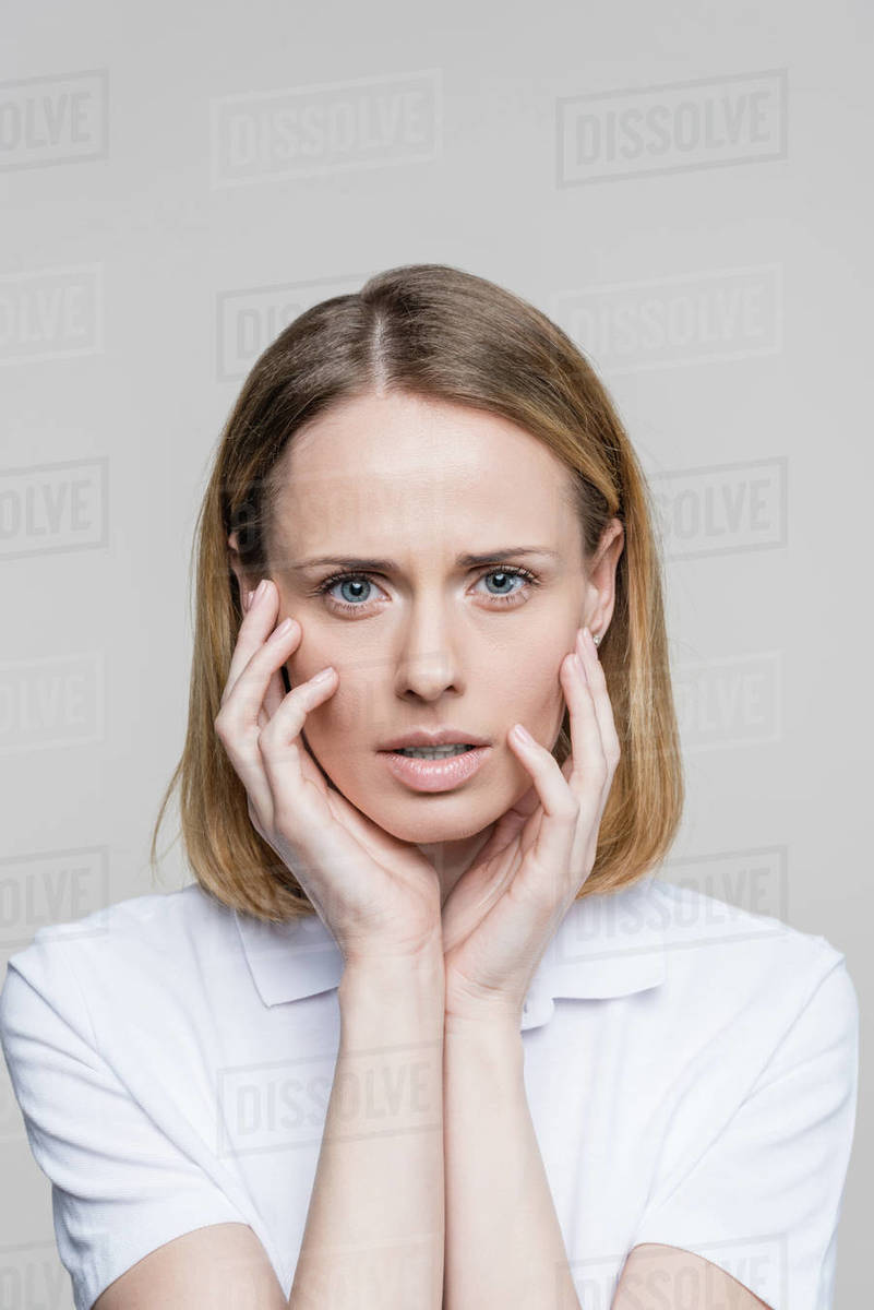 Portrait of attractive worried woman, isolated on grey - Royalty-free ...
