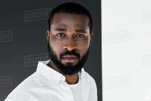 Portrait of handsome stylish african american man in white clothes on ...