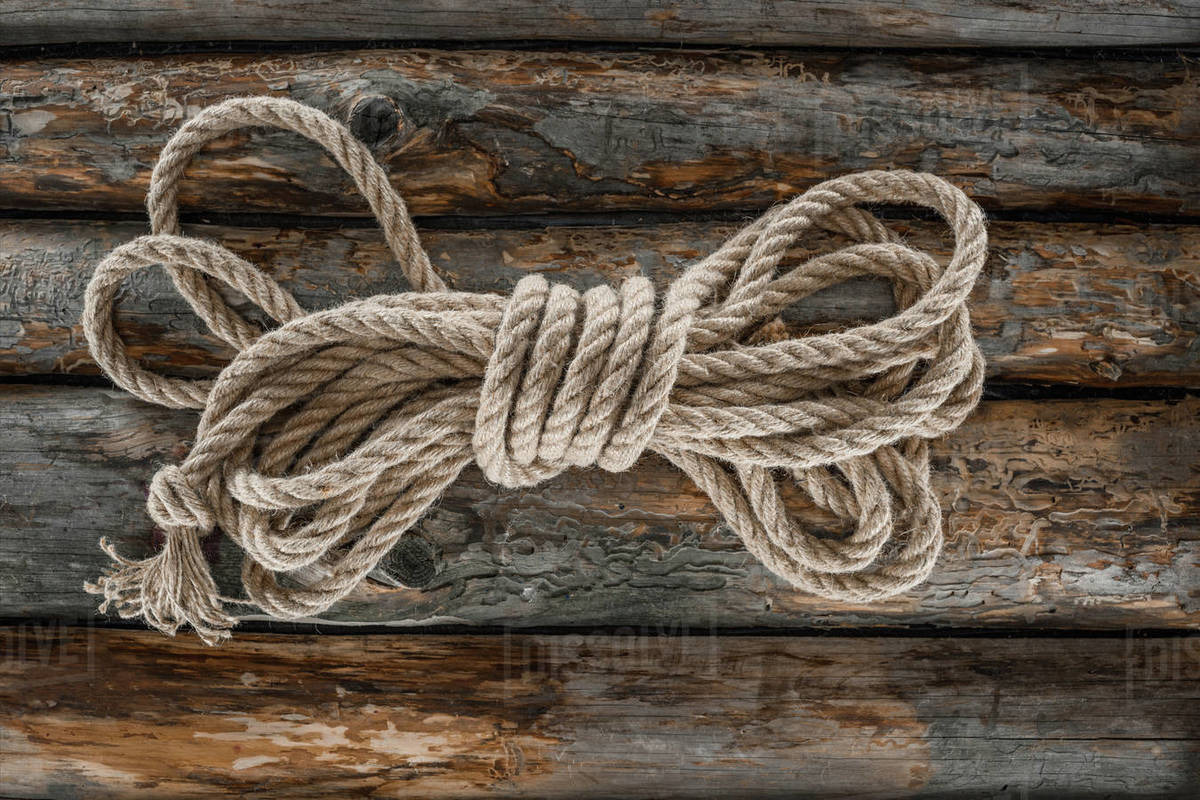 Top view of tied nautical rope on grunge wooden surface - Royalty-free ...