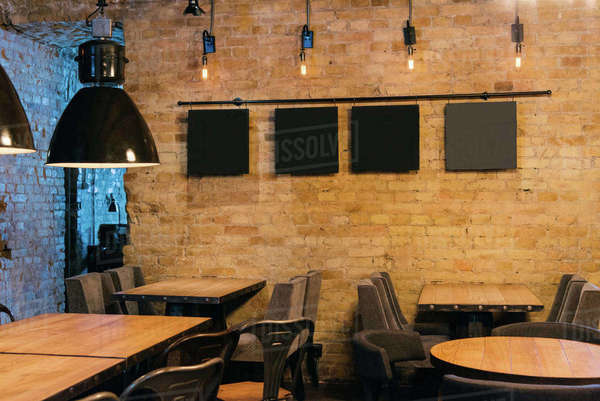 Stylish atmospheric interior of empty pub - Stock Photo - Dissolve
