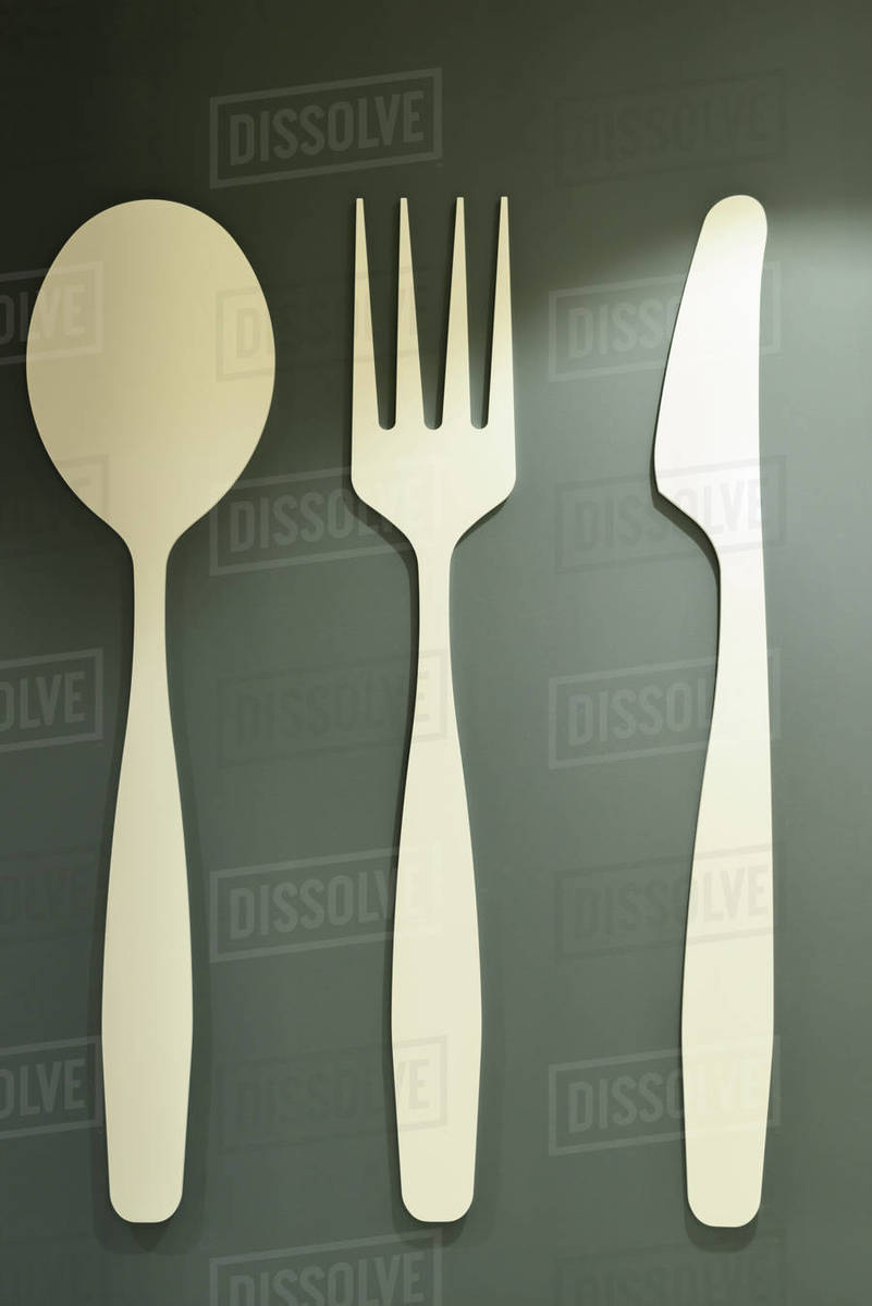 Set of decorative wooden cutlery on grey background - Stock Photo ...