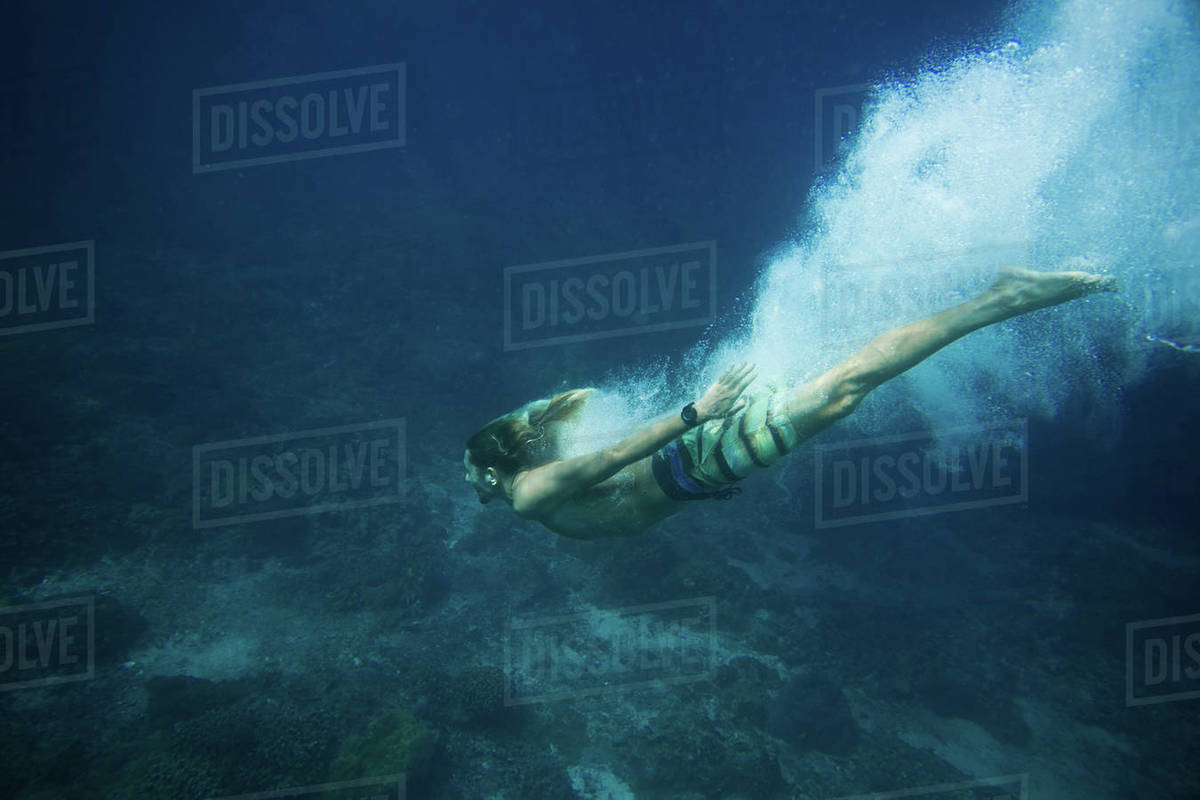 Underwater pic of young man diving in ocean alone - Royalty-free Stock ...