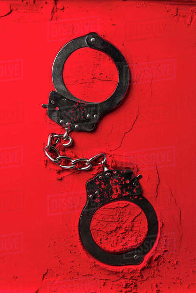 top view of black handcuffs red powder - Royalty-free Stock Photo ...