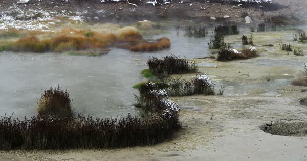 Steam wafting over water in a geothermal hot spring area. - 4K Rights ...