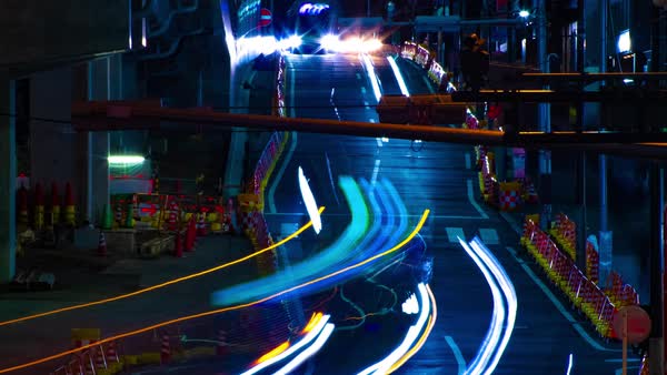 A night timelapse of the urban city street in Shibuya Tokyo long shot ...