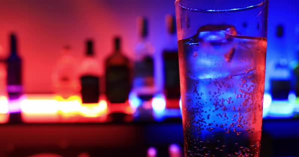 A bottle glass of soda water with neon light - 4K Royalty-free Stock ...