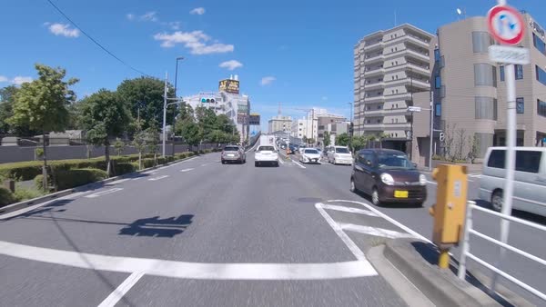 A pov of driving cityscape on the city street in Tokyo in summer wide ...