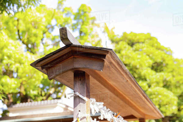 A Japanese traditonal roof at Tomioka Shrine - Stock Photo - Dissolve