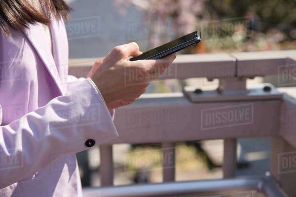 Body parts of hands using smartphne by Japanese woman at the street ...