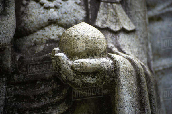 A religious stone statue of Jizo at Japanese buddhism temple - Royalty ...