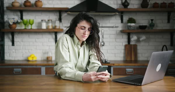 Transgender woman scrolls social media on smartphone - 4K Royalty-free ...