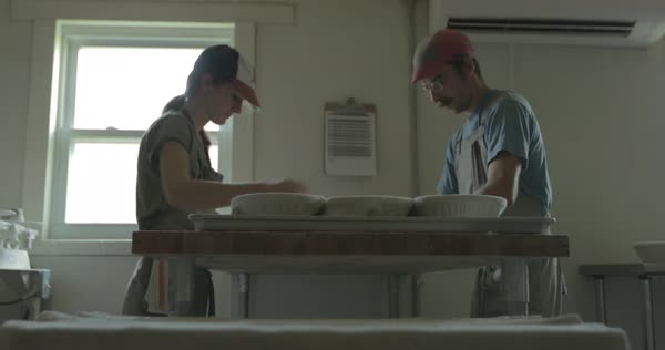 Bakers work in a bakery making healthy bread. - Stock Video Footage ...