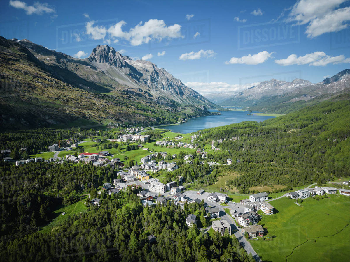 Aerial image of Maloja village and mountain pass road near lake Sils ...