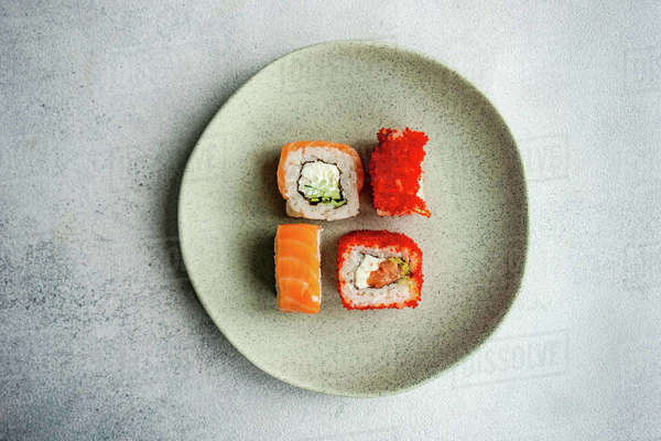 Overhead view of four Japanese maki rolls on a plate - Royalty-free ...