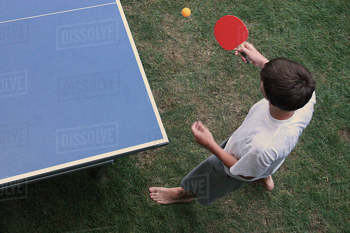 Elevated view of boy playing table tennis - Royalty-free Stock Photo ...
