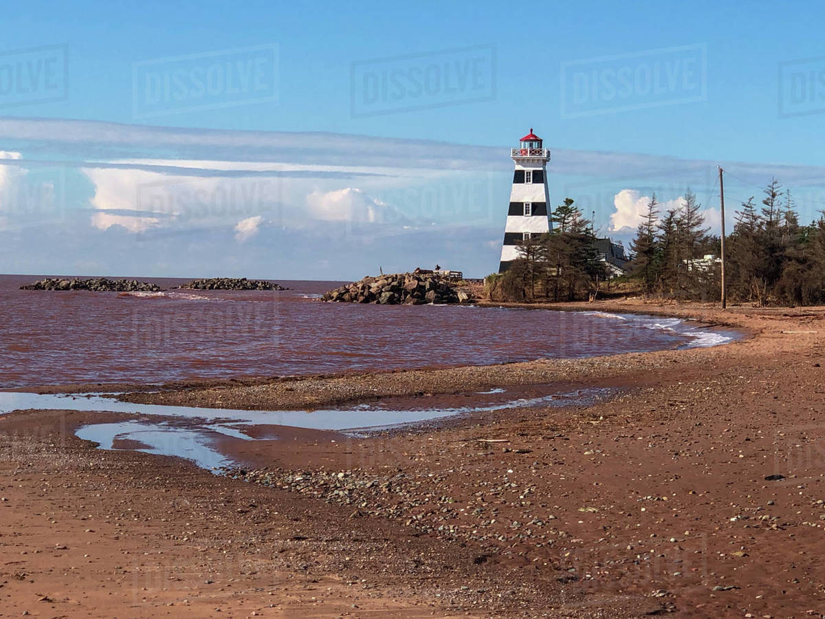 West Point Lighthouse and red ocean after a hurricane, Cedar Dunes ...