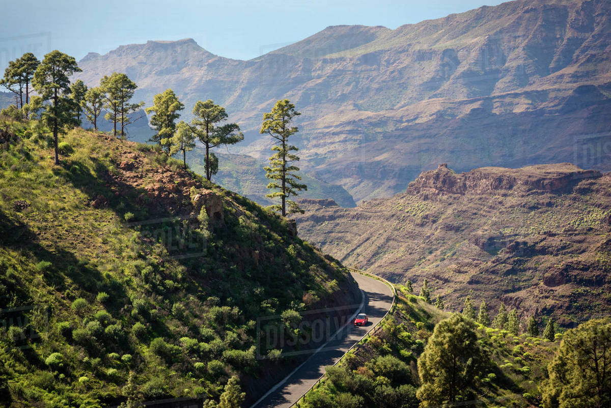 Aerial View Of A Car Driving Along A Mountain Road Roque Nublo Rural