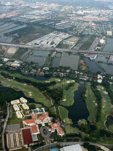 Aerial cityscape and golf course view from an aircraft, Bangkok ...