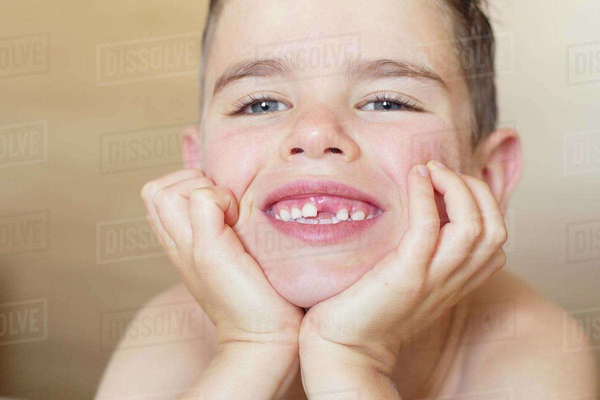 Portrait of a gap toothed boy smiling - Royalty-free Stock Photo | Dissolve